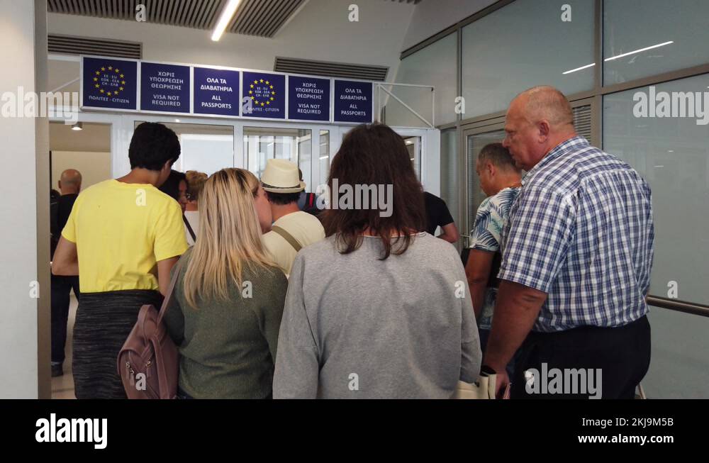A crowd of people queues for passport and visa control. Schengen ...