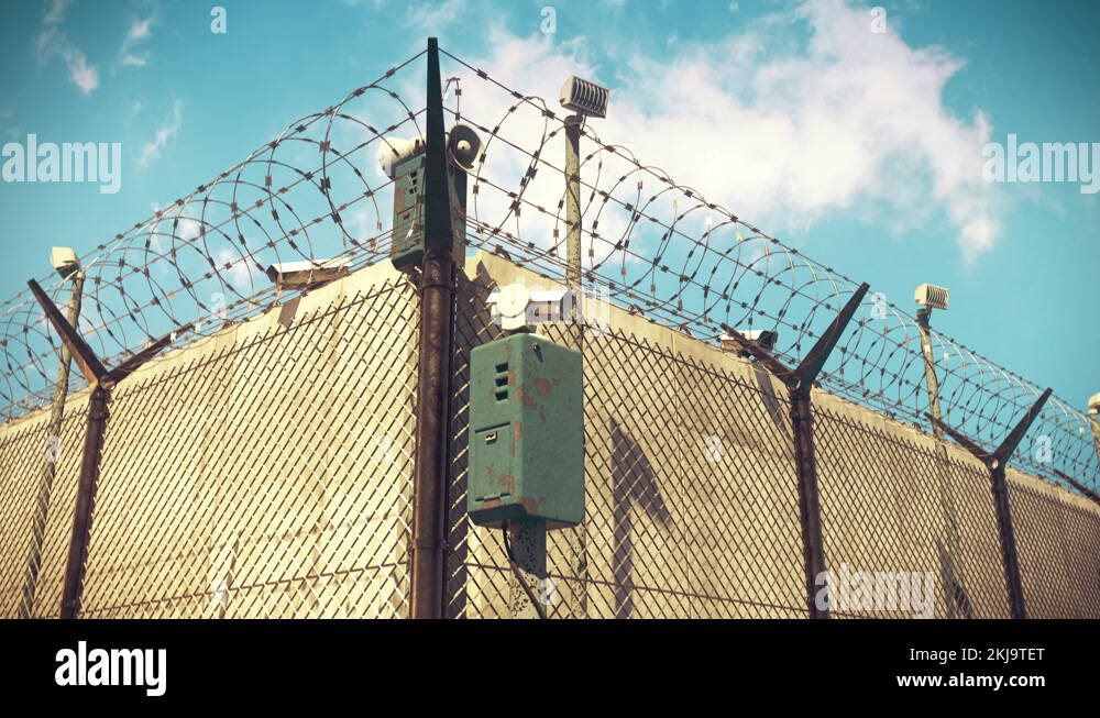 Security Camera Over Barbed Wire Fence Cctv Footage Surveillance Penitentiary Stock Video