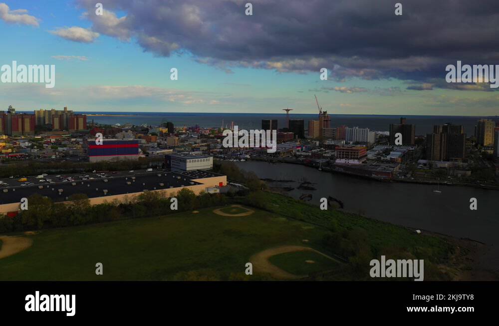 Pan View of Dark Clouds Over the Coney Island Skyline Stock Video ...