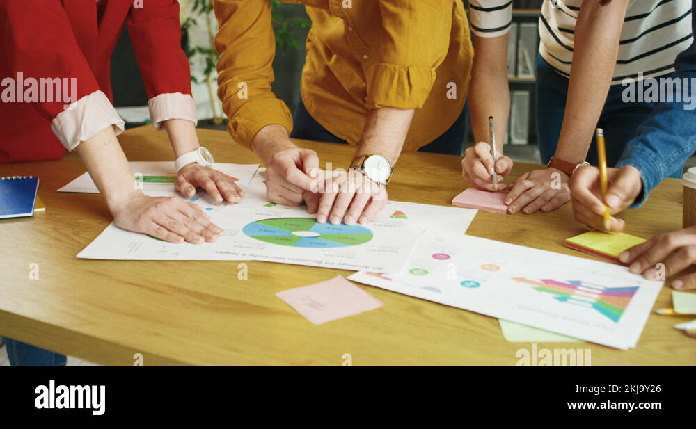 Close up of papers and documents with charts, graphics and diagrams ...