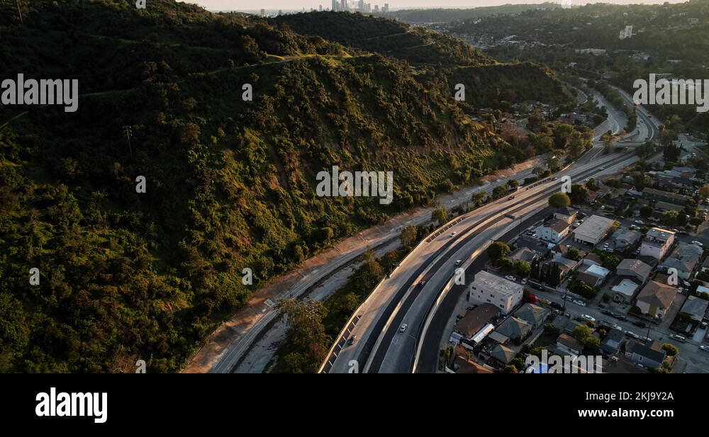 Downtown Los Angeles and curvy hills revealed from Freeway-110 empty ...