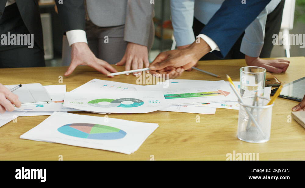 Close up of papers and documents with charts, graphics and diagrams ...