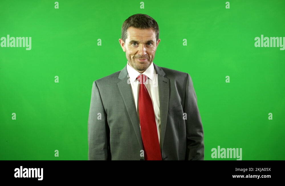 Businessman in Suit smiling to the camera. Business. Green screen ...