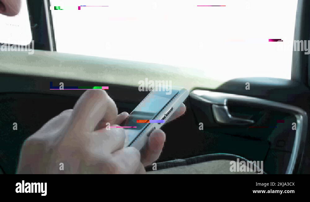 Bad signal glitch signal over woman driving in modern luxury car typing on Stock Video Footage ...