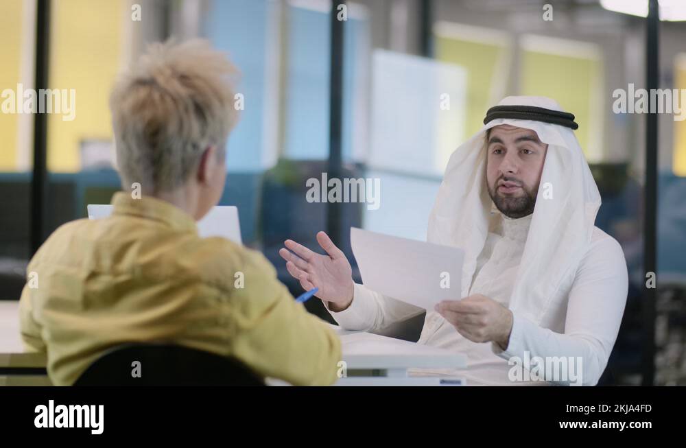 Arab businessman in a business meeting with a partner. Discussion of ...