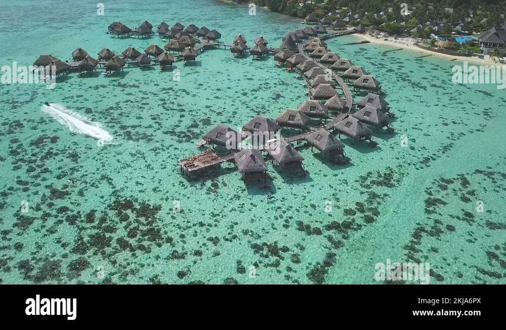 drone overwater bungalows in French Polynesia with moving boat Stock ...