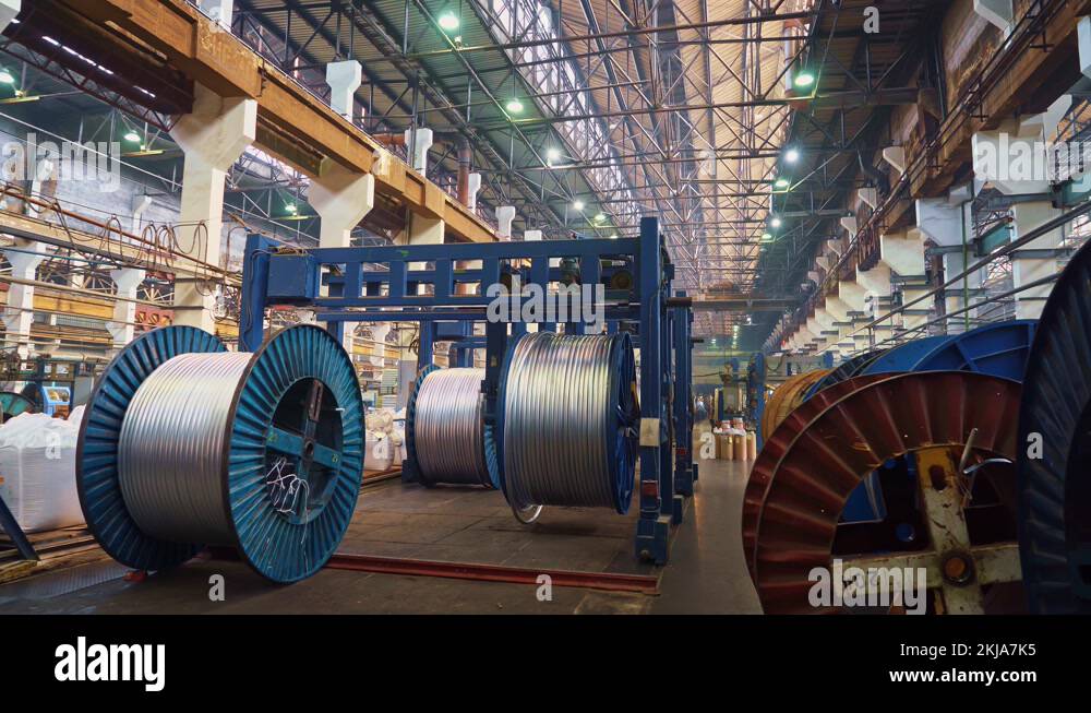 Cable factory. Metal, optical, copper, power wires are wound on huge ...
