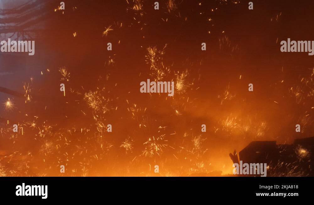 The scene of the smelting molten iron sparks in the blast furnace cast ...