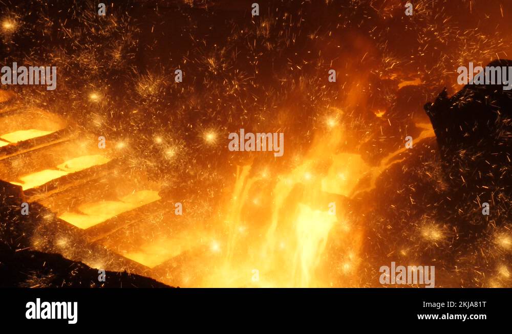The scene of the smelting molten iron sparks in the blast furnace cast ...