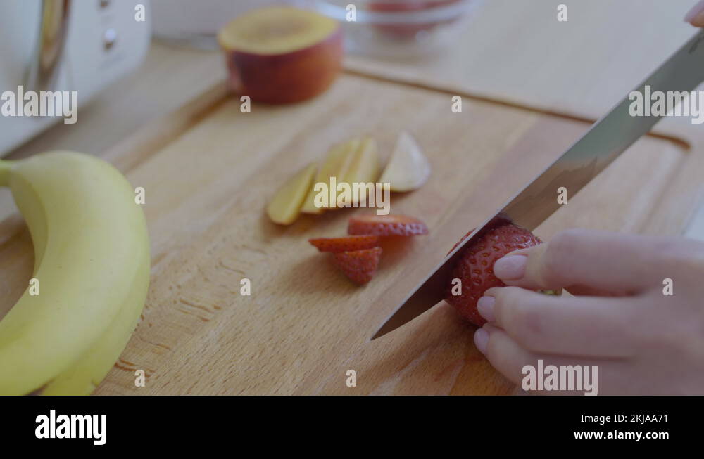 Woman Cutting Fruits and Berries Stock Video Footage - Alamy