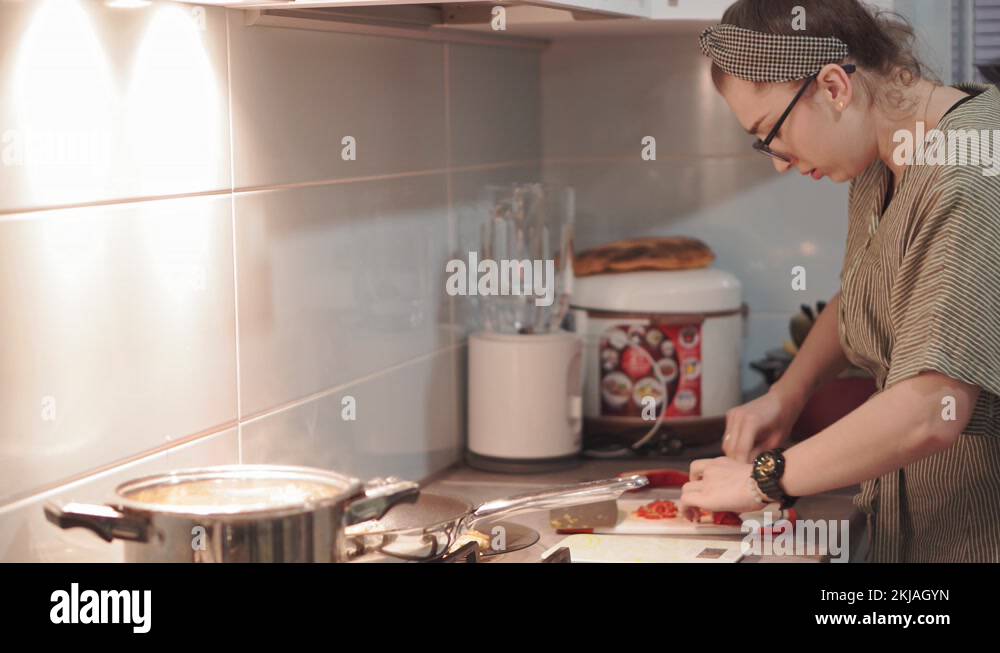 Beautiful lady cooking soup kitchen girl woman food Stock Videos ...