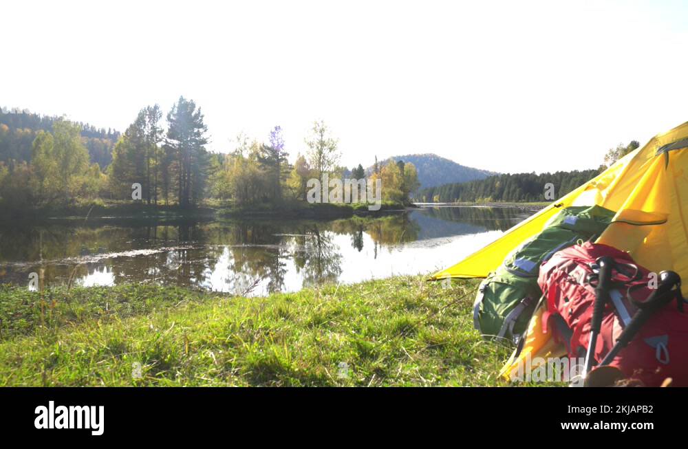 Camping woman lying in tent Close up of Girl feet wearing hiking boots ...