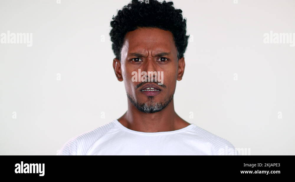 Disappointed black guy looking down reaction. African person feeling ...