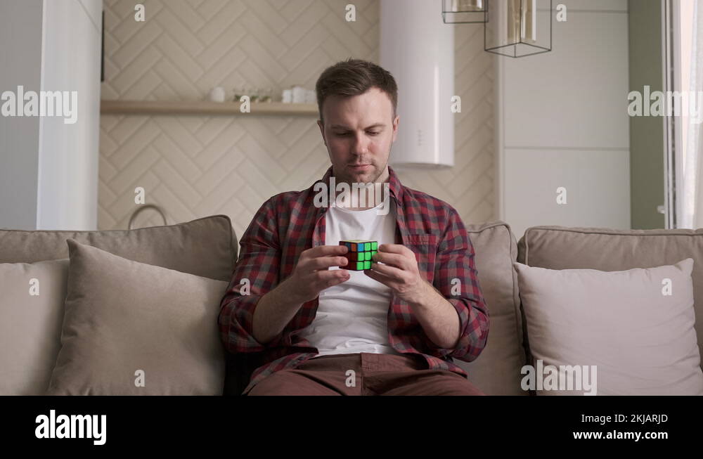 Man with rubik cube Stock Videos & Footage - HD and 4K Video Clips - Alamy