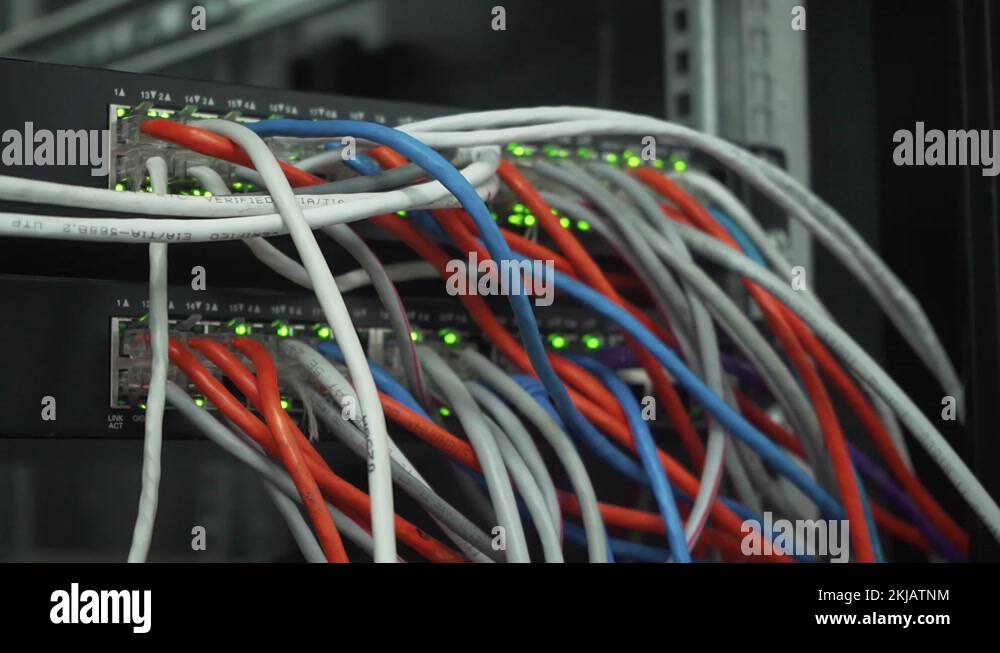 Close up fiber optic in server room. Network cables installed in the ...