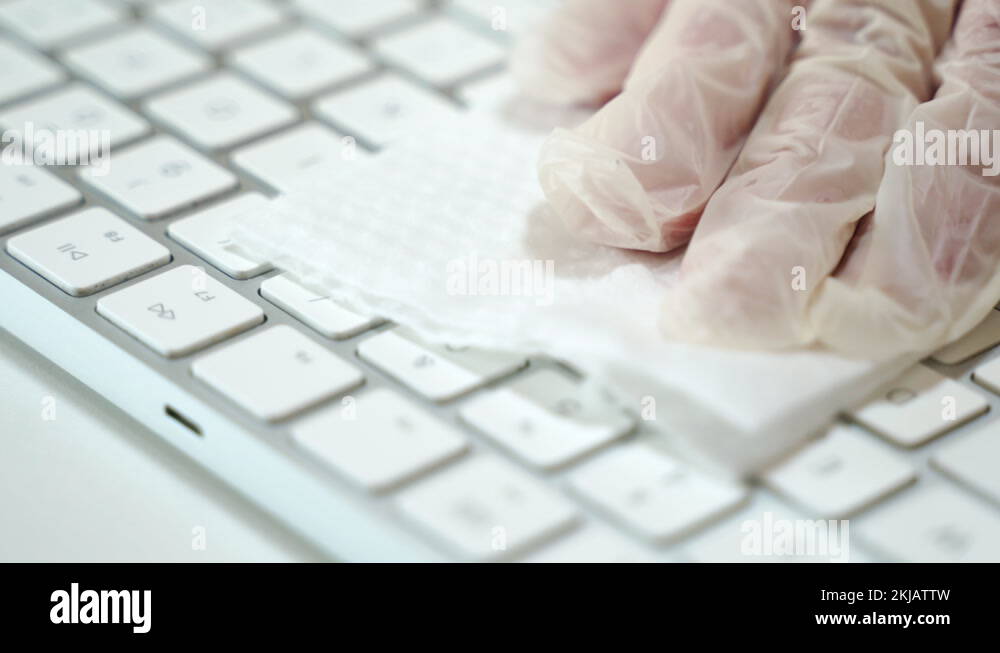 Total cleaning and disinfection of white dirty laptop keyboard with wet ...