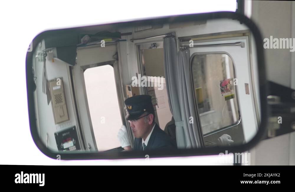 Train Conductor In The Cockpit Driving The Train In Kyoto, Japan ...