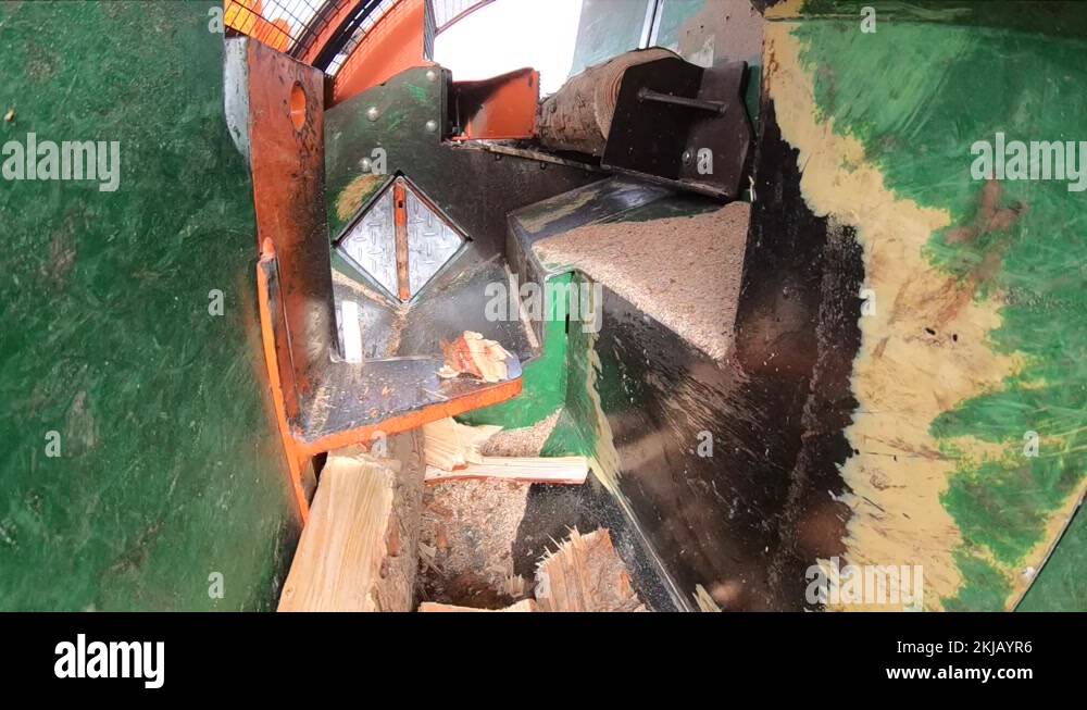 Process of logs being cut into firewood, inside the machine, natural ...