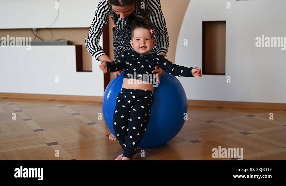mom is doing exercises for the baby. Baby and mom develop body motility Stock Video Footage - Alamy