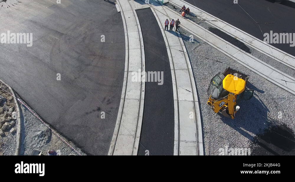 Asphalt spreading machine and vibration roller at pavement road works ...