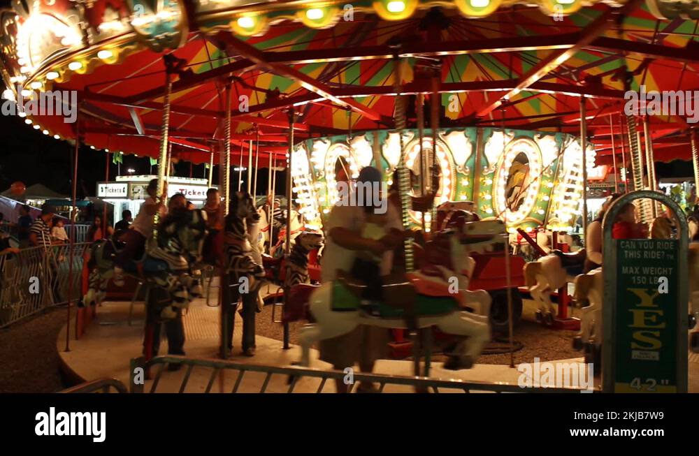 merry go round riders take a carnival ride at night Stock Video Footage ...