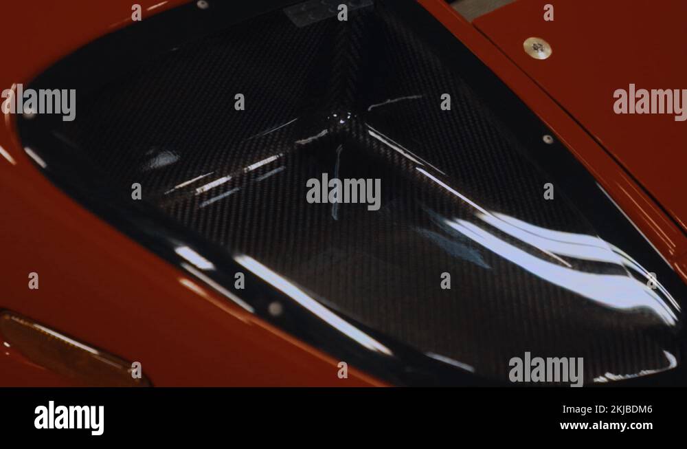 Dolly Shot of a Carbon Fiber Headlight on Red Ford GT3 Super Car Stock ...