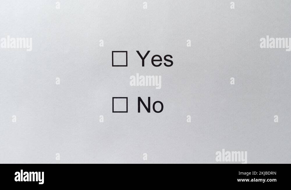 YES NO Man hand draw a tick in Yes checkbox on white paper with pen ...