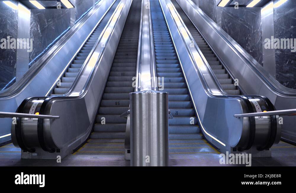 Escalator at the metro station. Escalator in the subway. Empty moving ...