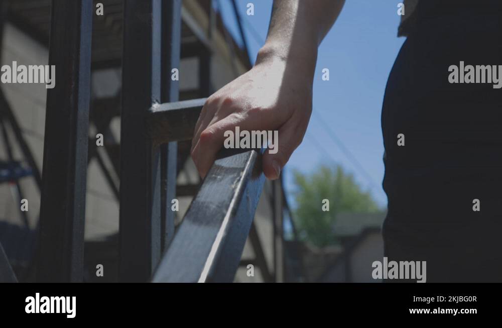 A Man's Hand On The Steel Railing While Walking Down The Stair Outdoor ...