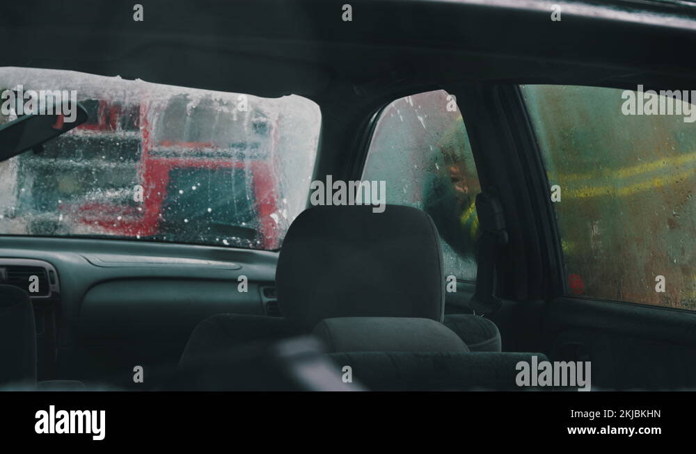 Car accident rescue, firefighter breaking the glass on the car door ...