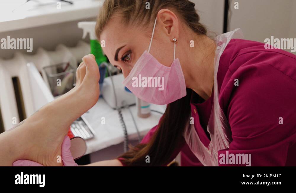 Pedicure master cleans the legs of a woman Stock Video Footage - Alamy