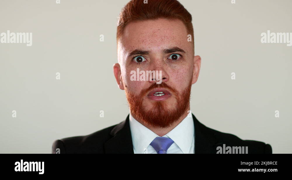 Business man shock reaction. handsome man wearing suit reacting with ...