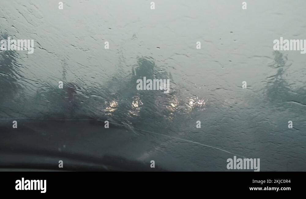 lightning flash in slow motion during a thunderstorm from a car window ...