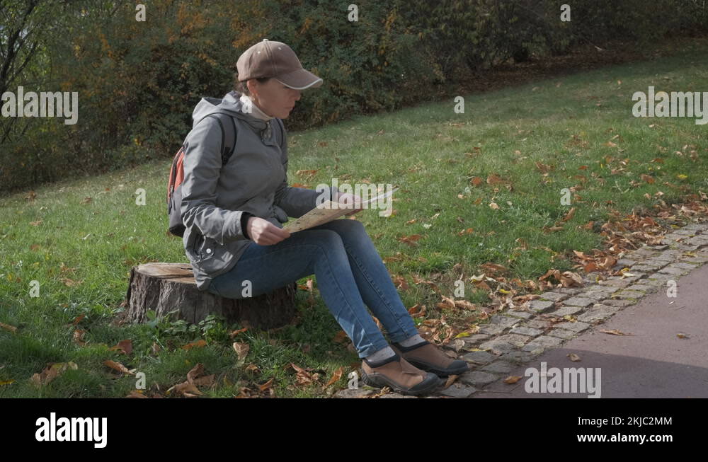 Tourist on a stump with a map Stock Video Footage - Alamy