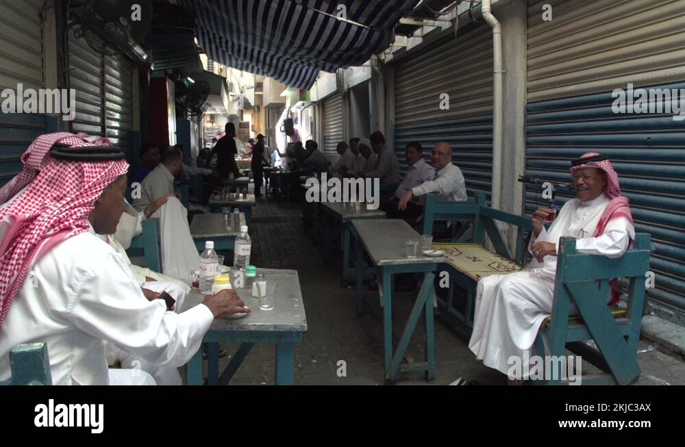 Patrons at a traditional "gahwa" or coffee shop / café in the centre of ...