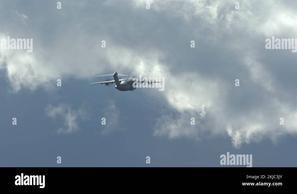 military airbus a400 propeller aircraft take off steep climb back lit ...