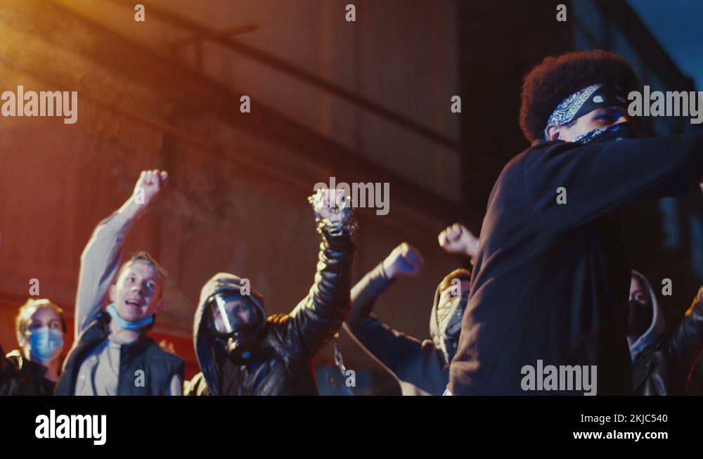 Mixed-races young people screaming mottos against racism and violence ...