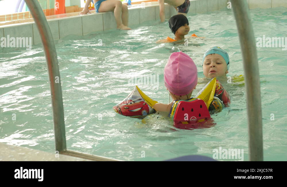 Kids learning to swim in swimming pool at kindergarten Stock Video ...