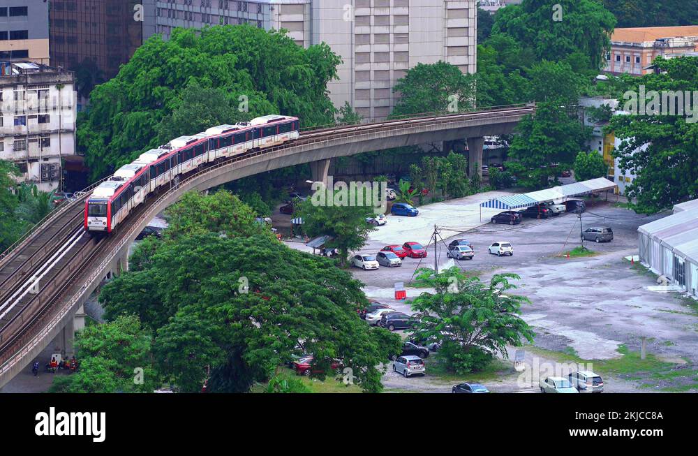 Light Rail (LRT) through the city center. Top view of a train passing ...