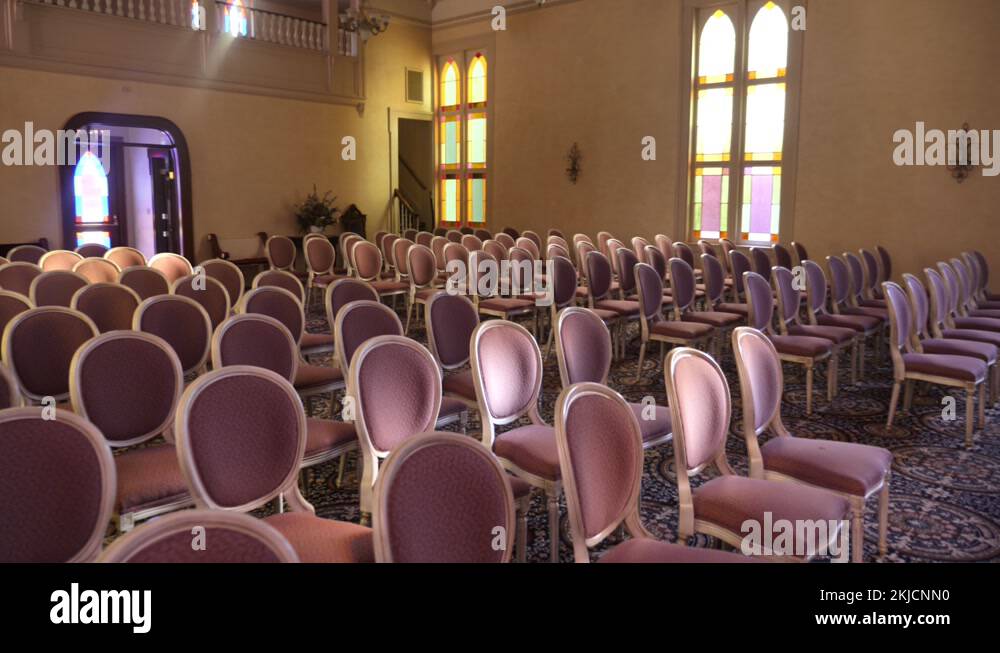Empty chairs in interior of catholic chapel in small american city ...