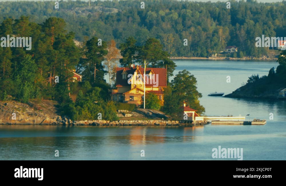 Beautiful waterfront homes with docks and boats on tiny islands of the ...