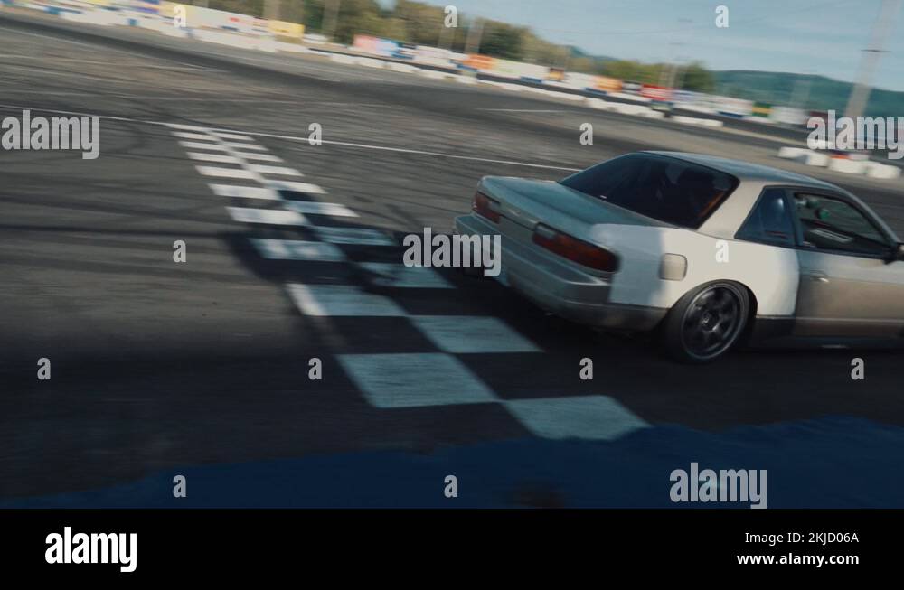 Group of Cars Drifting into the Corner of a Race Track at Drift Con ...