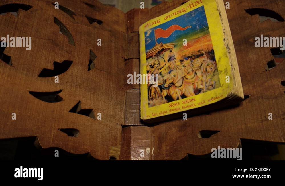 bhagwat geeta also Bhagavad Gita on the book stand Stock Video Footage ...
