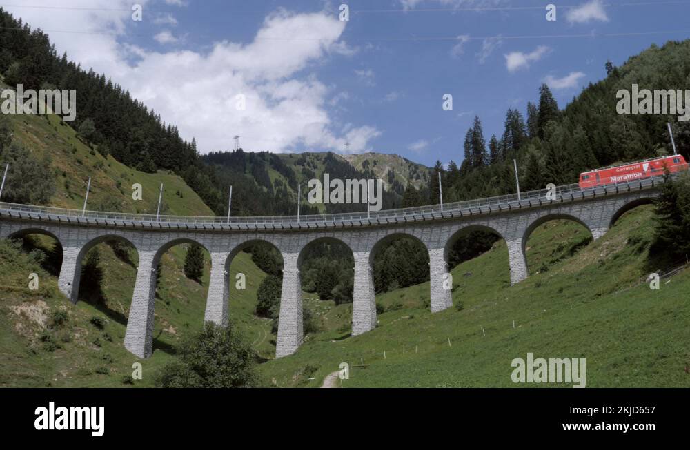 Val Bugnei Viadukt. August 2019. Train passing over the Val Bugnei ...