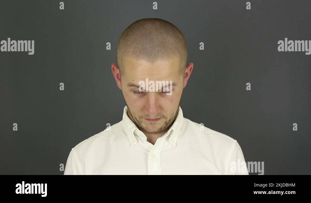 A funny handsome guy says yes and nods affirmatively. Portrait on a ...