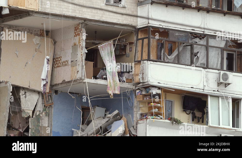 Rescuers dismantle the rubble in a residential building after a gas ...
