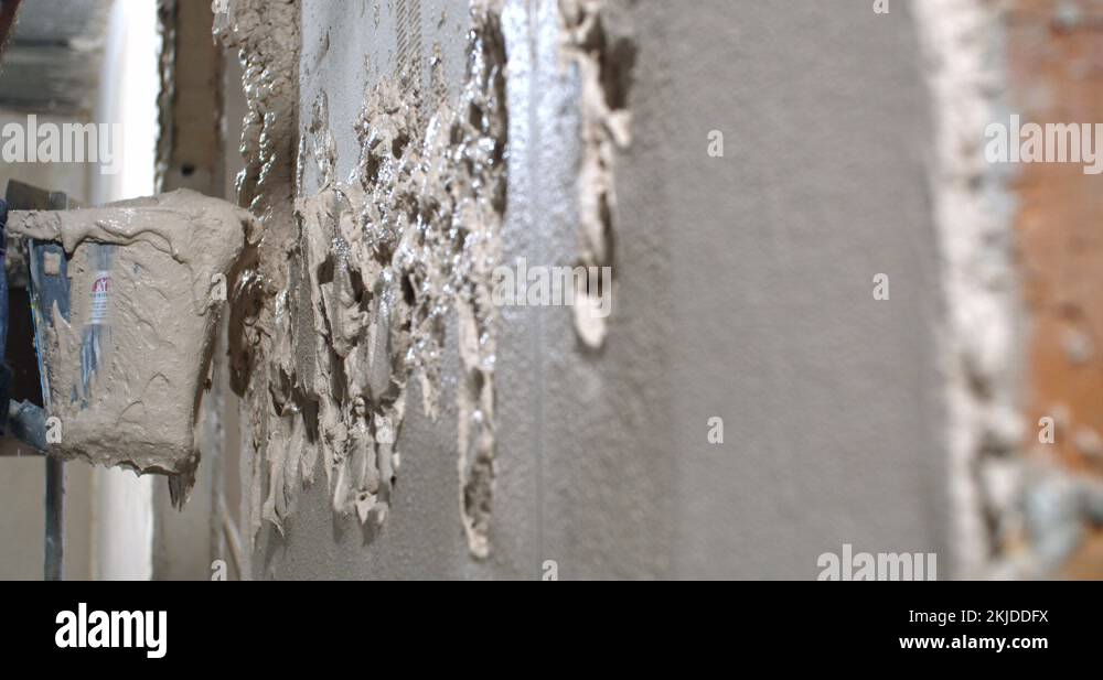 Using the plaster hopper bucket to spray the walls with plaster, 4k ...