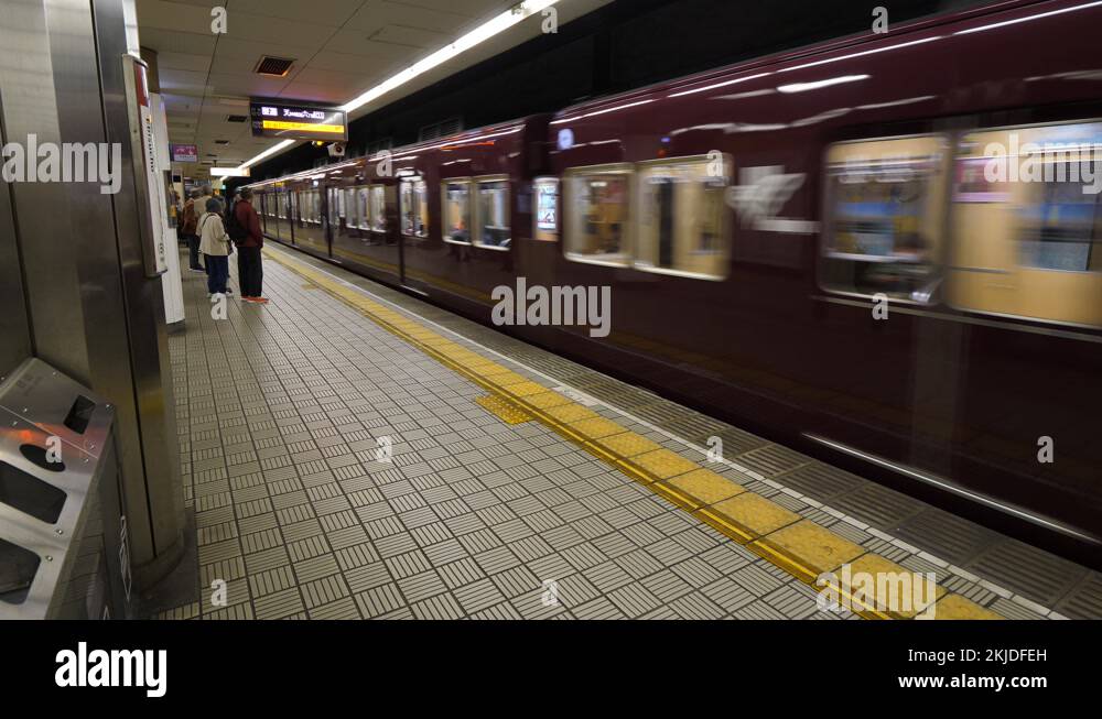 Metro coach arrive to station, wide angle shot of platform and train ...