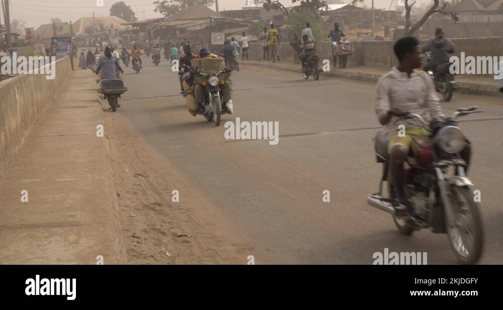 A busy road,Crowd of People,Motorcycles,cars and local seller in Africa ...