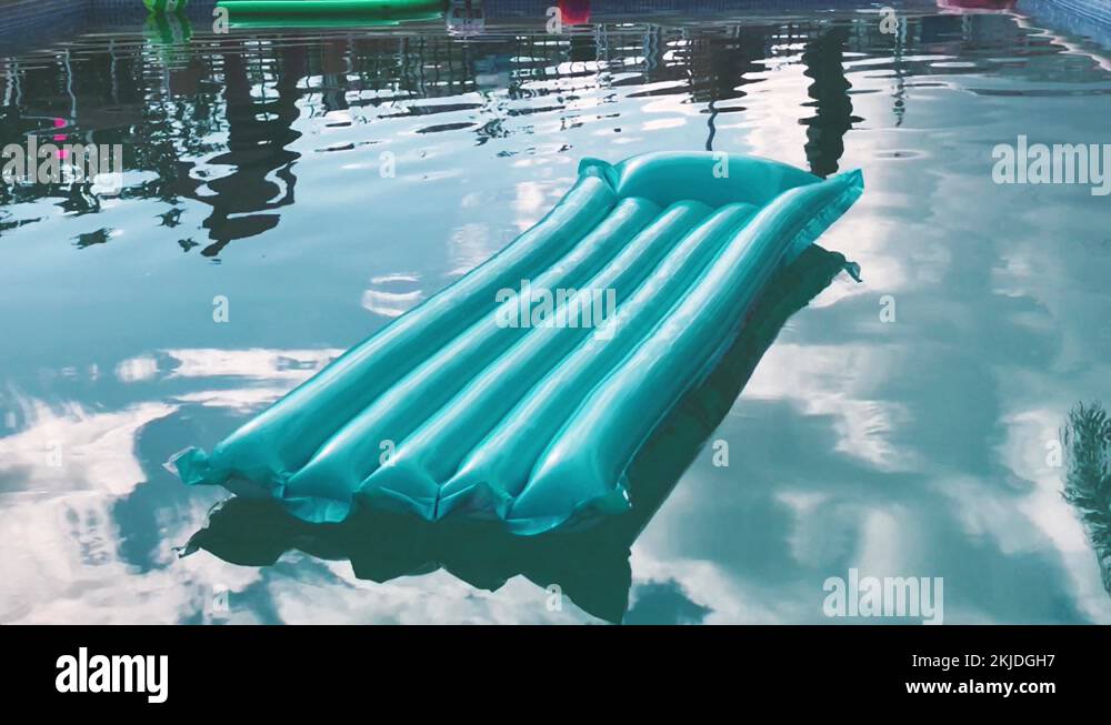 Inflatable airbed floats in swimming pool. Static shot Stock Video ...